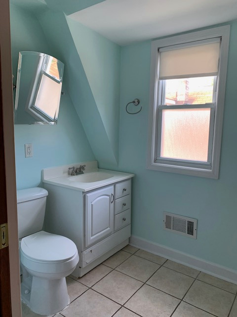 How to deal with sloped bathroom ceiling above vanity? | Houzz Forum