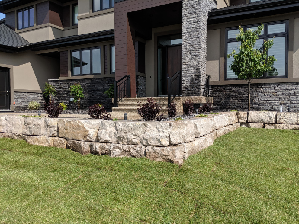 Linear patio and Armour stone retaining wall we built in Edmonton ...