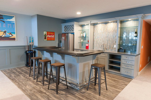 Basement Bar with Island, Luxury Vinyl Flooring, and Corian Countertops ...