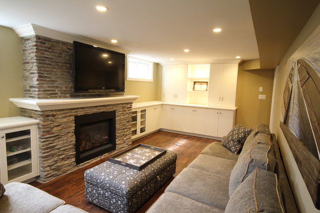 Basement recreation room with new stone fireplace and built-ins ...
