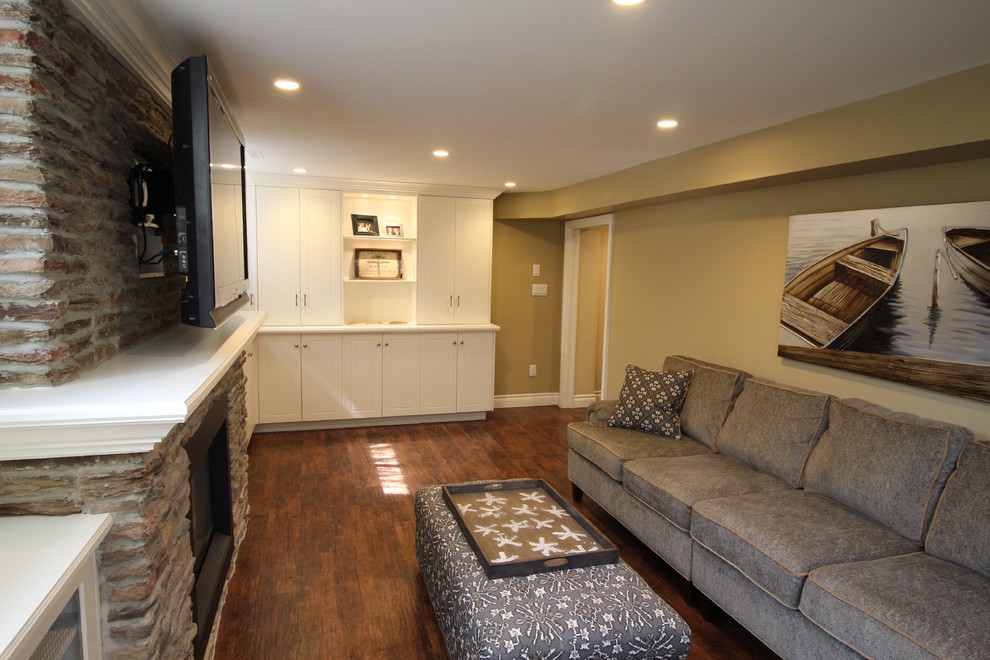 Basement recreation room with new stone fireplace and built-ins ...