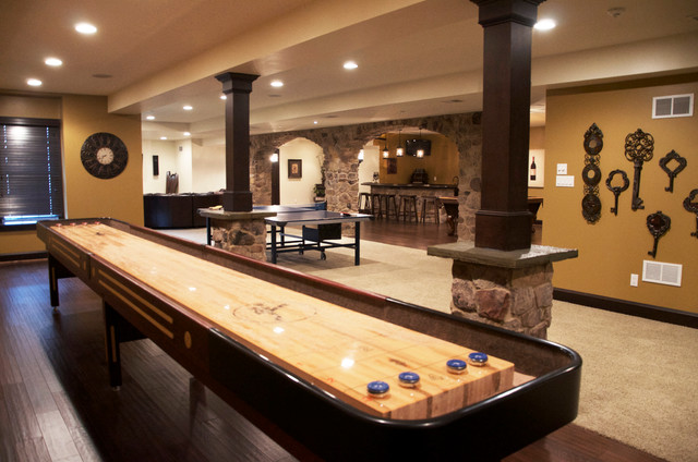 Basement with Curved Bar and Entertainment Areas - Traditional ...