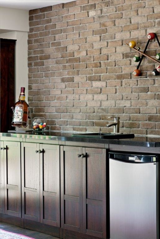 Creating an Exposed Brick Wall with Brick Veneer - Modern - Basement ...