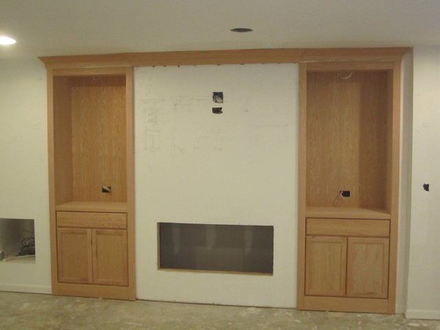 Fireplace surrounds and built-in units - Traditional - Basement ...
