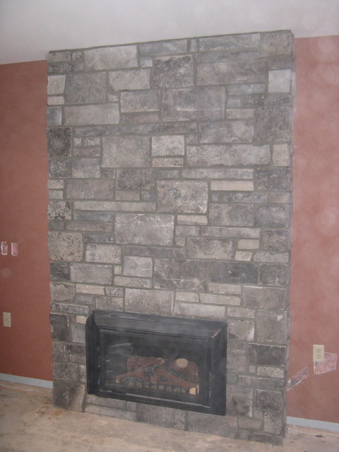 Natural stone veneer directly over existing brick fireplace ...