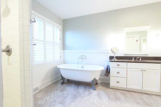 Coastal Master Bathroom with Beadboard and Clawfoot Tub - Coastal ...