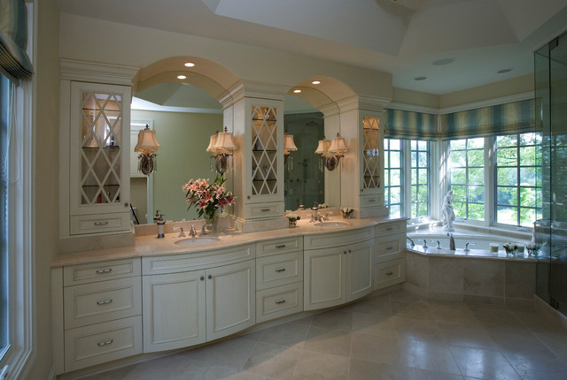 His and Her Vanities with arch-topped mirrors and glass-fronted towers ...
