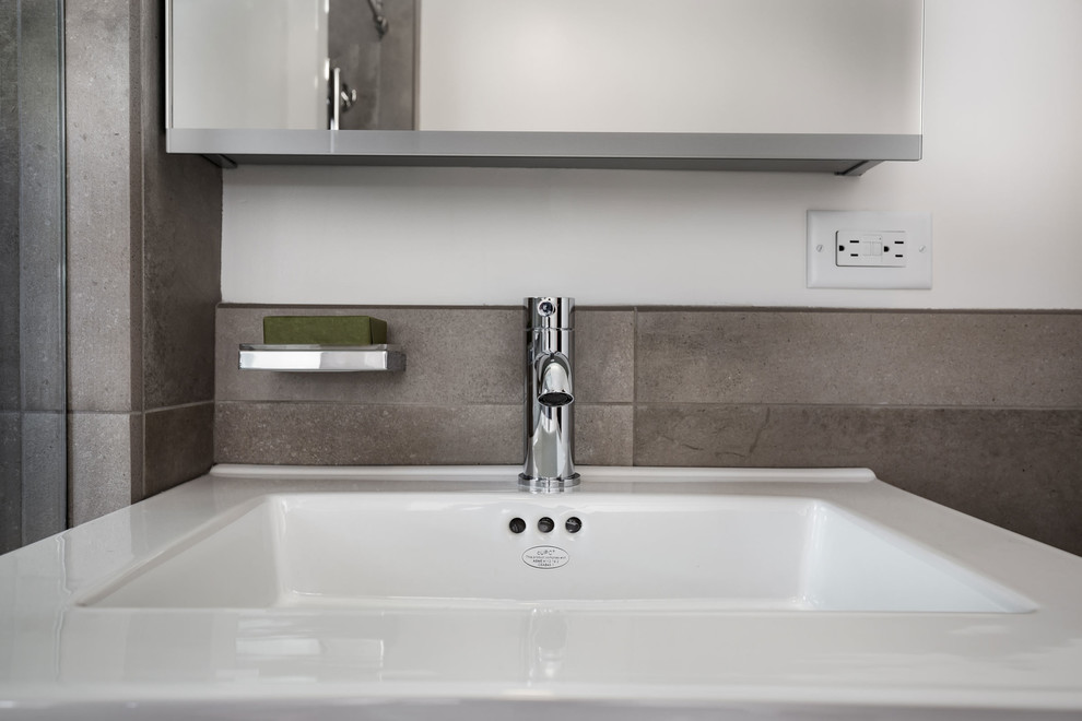 Integrated Porcelain Sink and Chrome Fixtures in Modern Bathroom ...