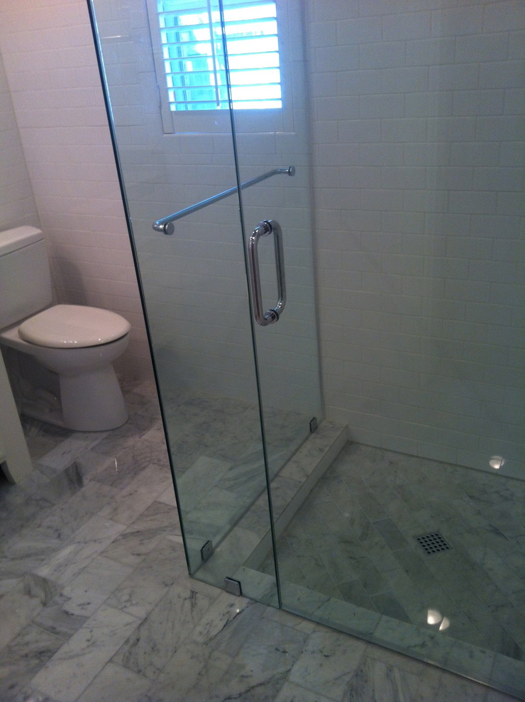 Jack & Jill bath converted to sleek marble restroom & shower ...