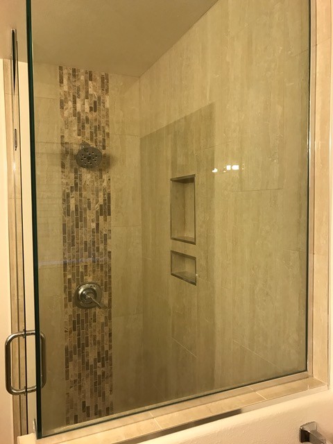 Polished porcelain tile shower with vertical deco band - Traditional ...