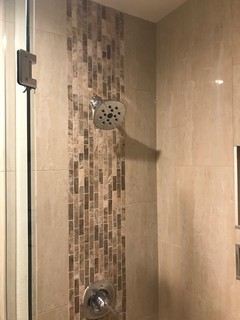 Polished porcelain tile shower with vertical deco band - Traditional ...