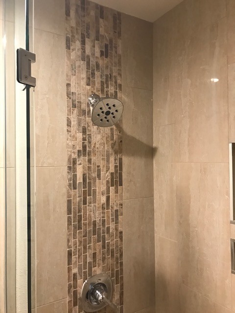 Polished porcelain tile shower with vertical deco band - Traditional ...