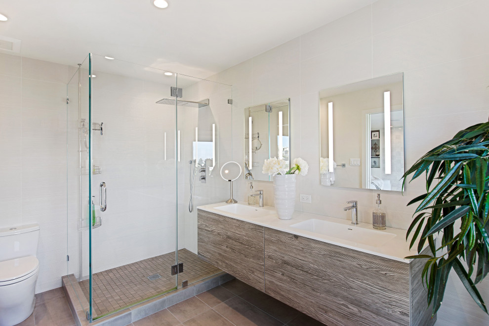 The bathroom in the primary suite with floating vanity - Modern ...