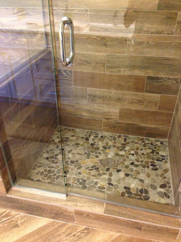 Shower remodel: Natural look with mosaic flat rock pebbles and wood ...