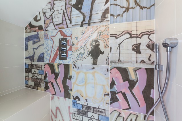 Whimsical touch of graffiti-style tiles in the bespoke shower enclosure ...