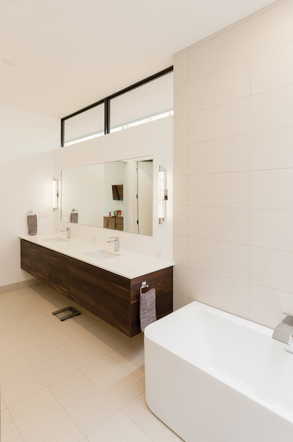 The aluminum clerestory windows bring light into the bathroom ...