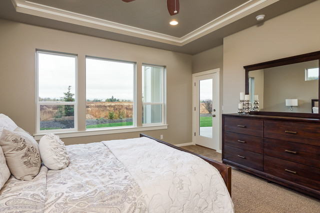 Master bedroom with big windows and door to the back covered patio ...