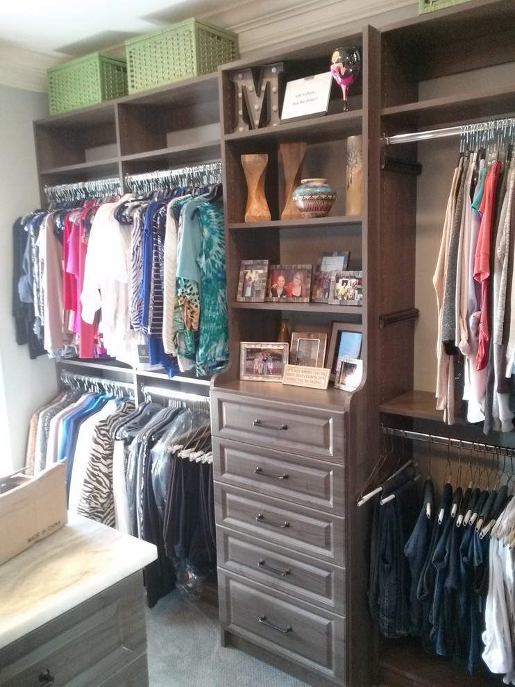 Beautiful Master Closet with island and unique jewelry cabinet ...