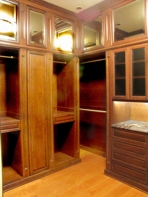 His master closet in wood with fluted columns and granite counters ...