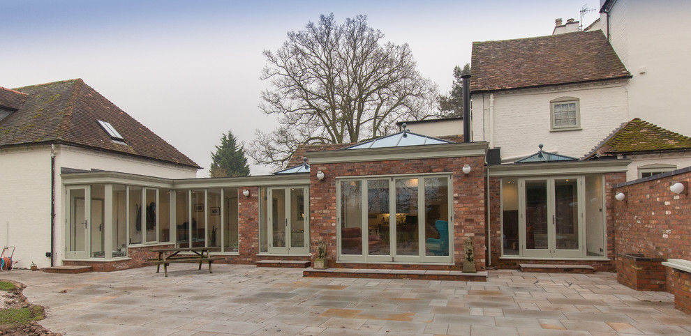 Large Orangery with multiple Lanterns, mutifold doors and link to ...