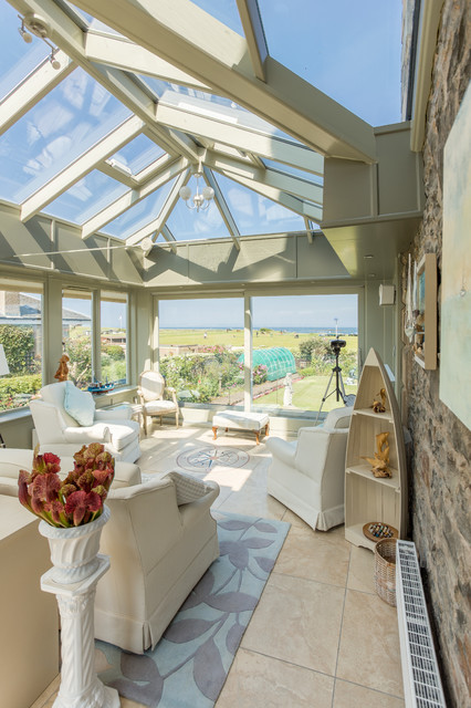 Stilted orangery with glazed balcony and seaside view - Coastal ...