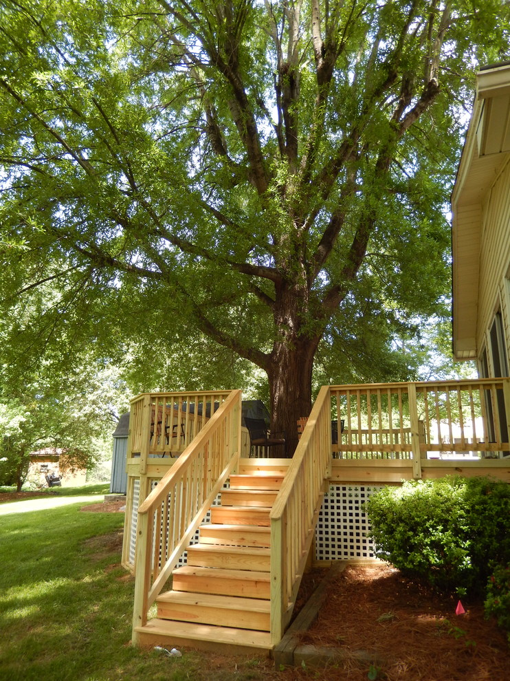 Custom Pressure Treated Wood Deck with Square White Vinyl Lattice ...