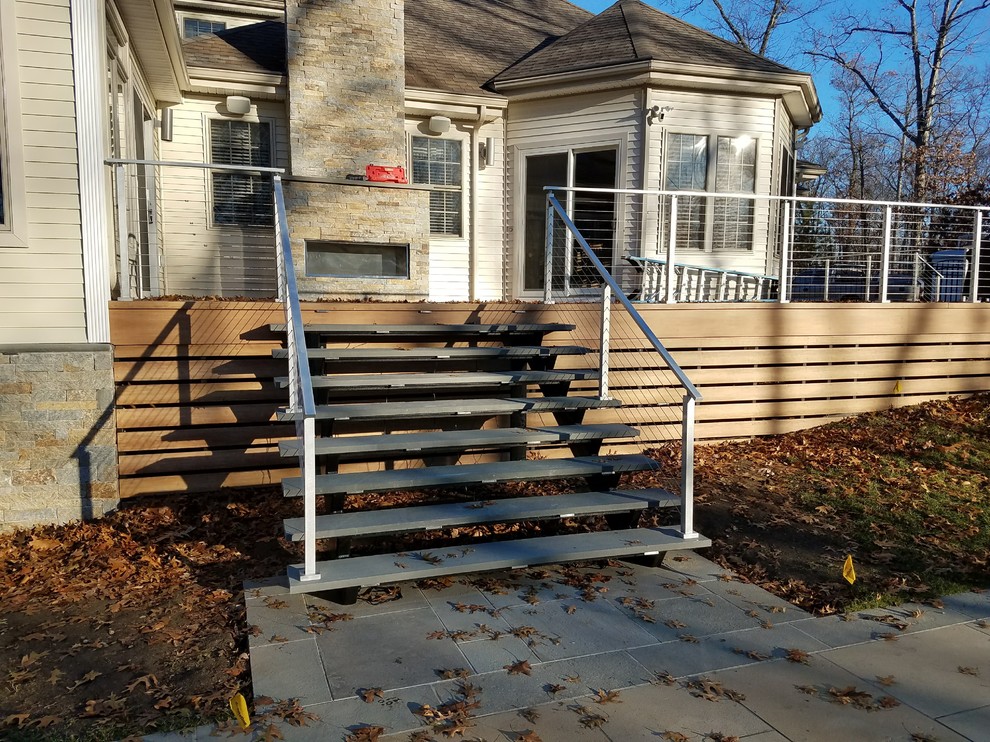 Deck with stainless steel cable railing, steel and stone floating ...