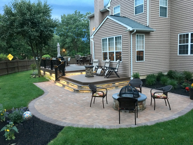 Multi level Trex deck with a patio and fire pit - Rustic - Patio ...