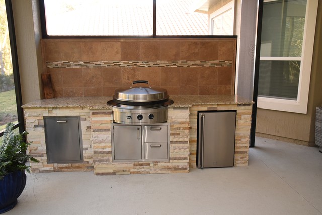 Outdoor kitchen with privacy wall and Evo flat top grill. - Traditional ...