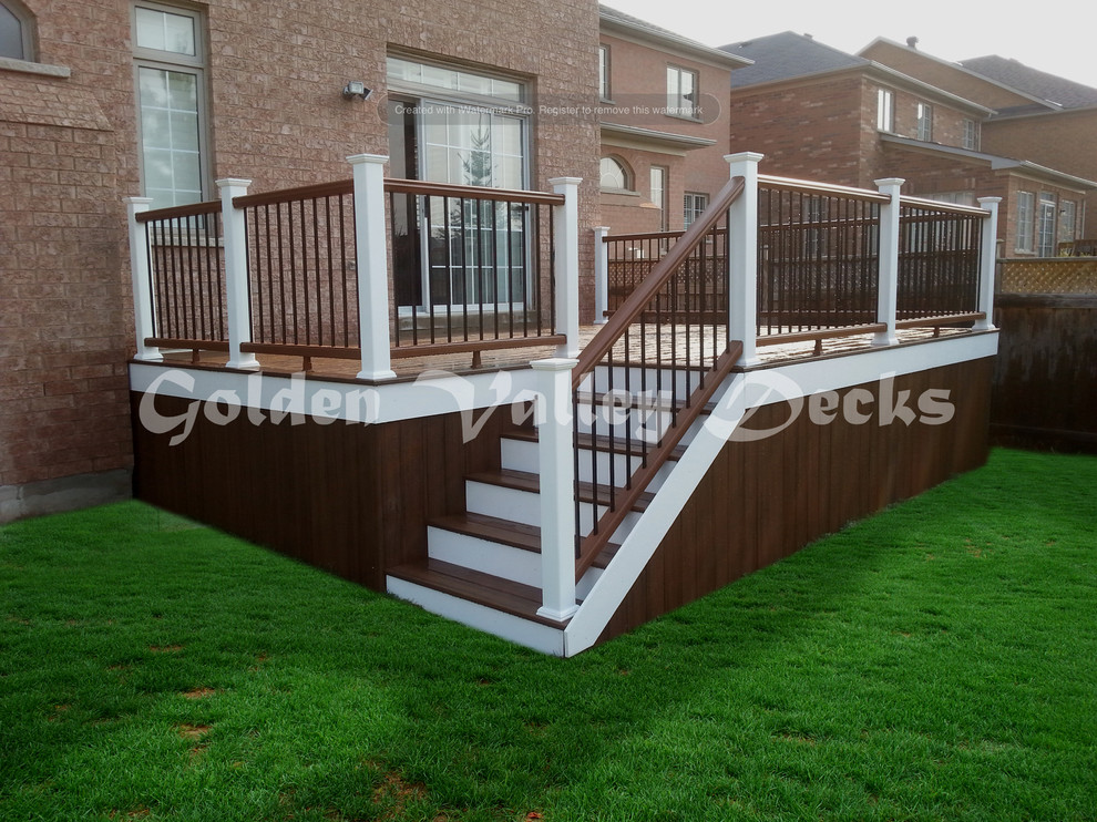 trex spice rum decking with white railing and white facia - Classico ...