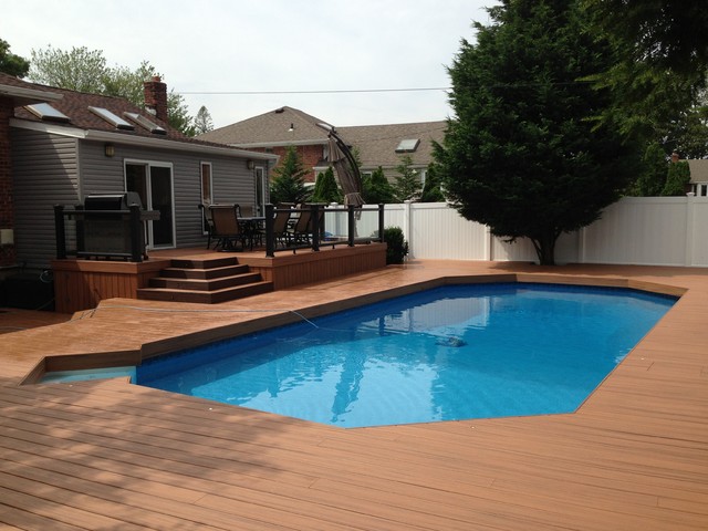 Trex Transcends Tropics Tiki Torch with Trex Black Glass Railing ...