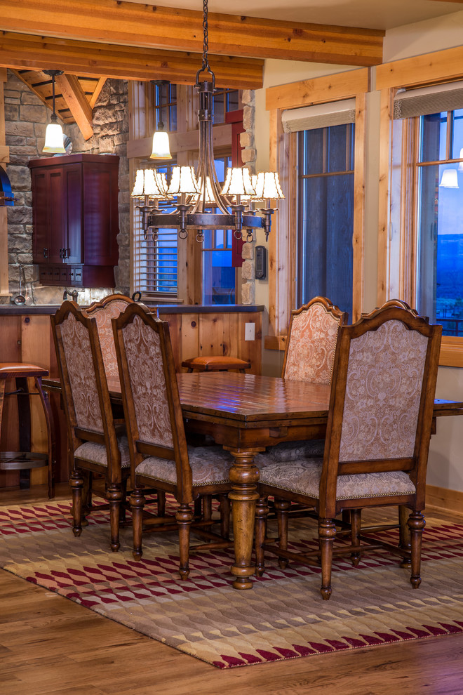 Brasada Ranch home open dining with raised bar to kitchen - Rustic ...