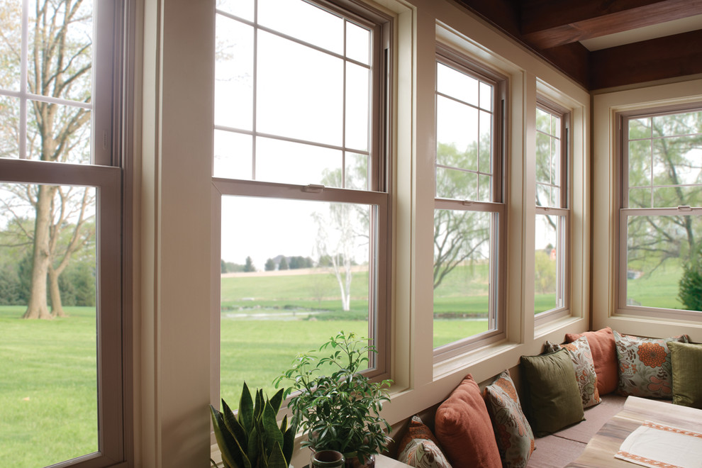 Tuscany Series single hung windows with perimeter grids in tan dining ...