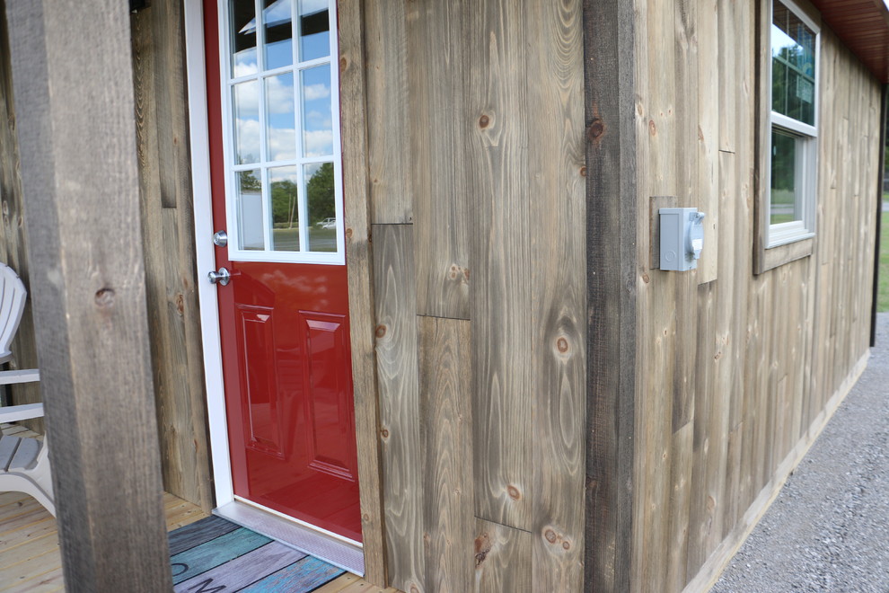 Barn wood siding on a small cabin gives it an especially rustic look ...