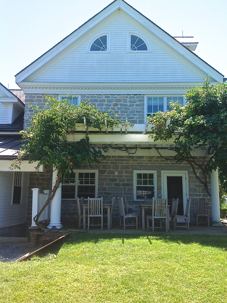 before photo of overgrown pergola over patio with access to basement ...