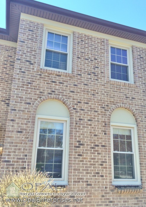 Brick Front Home with Beige Arch Top Hardie Panels, London Brown Soffit ...