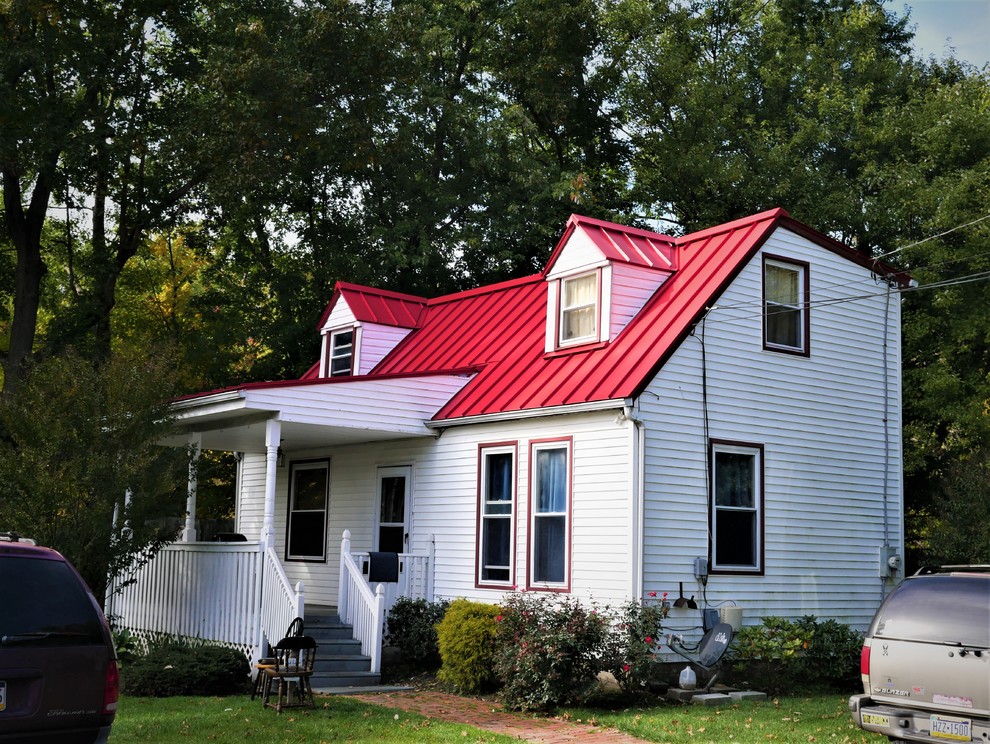 Brilliance Red Standing Seam Metal Roof on Home with White Siding ...