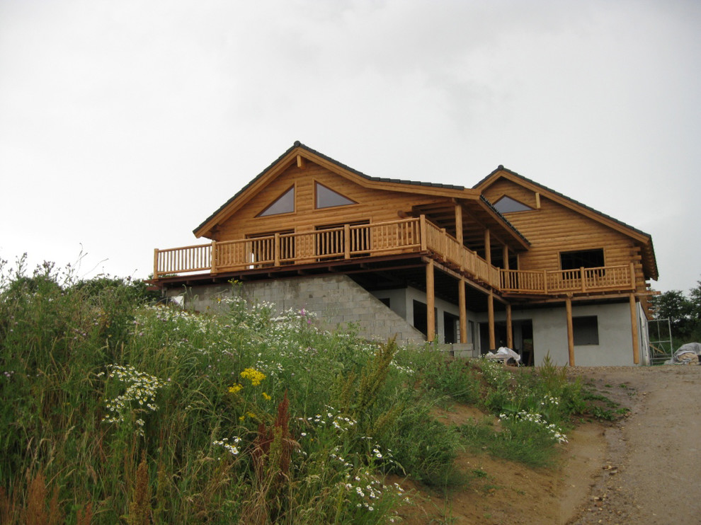 Cedar half log siding with cedar deck and railing - Rustic - Exterior ...