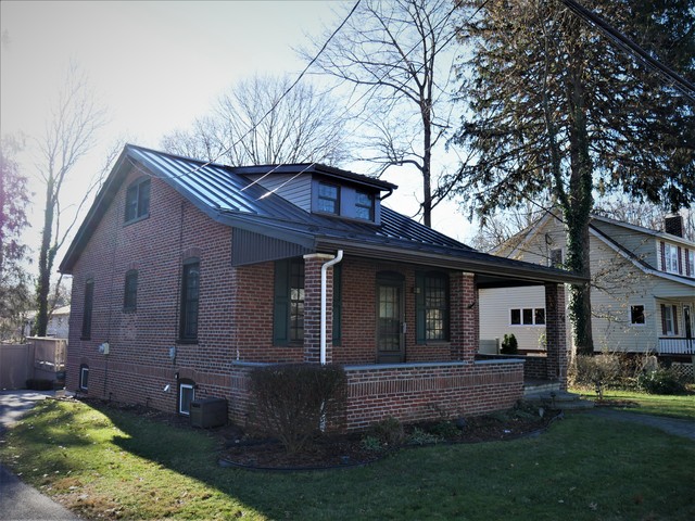 Cape Cod Style Home With Metal Roof
