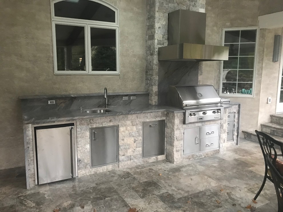 Elegant Outdoor Kitchen with Mitered Waterfall Quartzite - Industrial ...