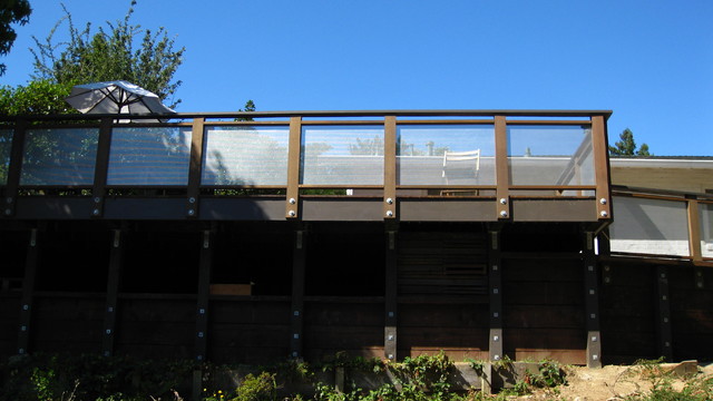 elevated deck/retaining wall with perforated metal panels - Trendy ...