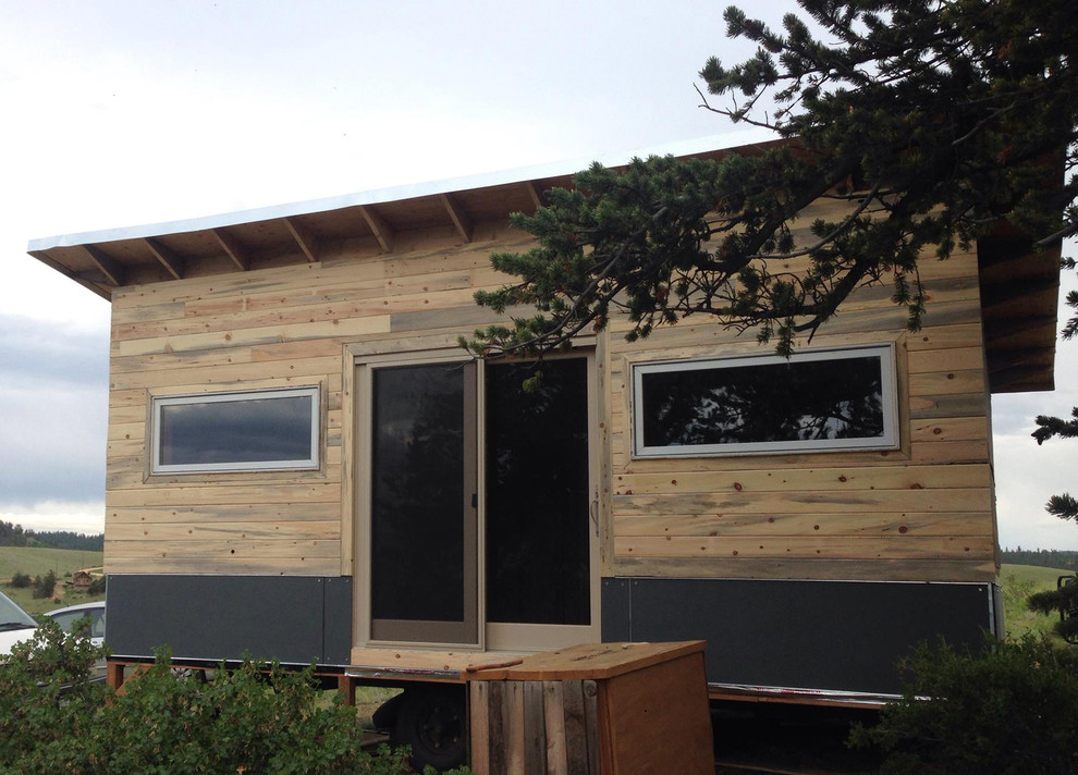 Front facade with ribbon windows, hardy board siding, and beetle kill ...