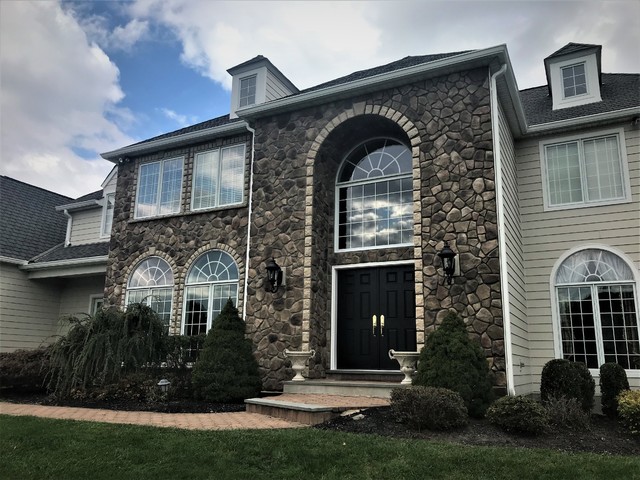 Installing Beige-Toned Stone and Hardie Siding - Traditional - House ...