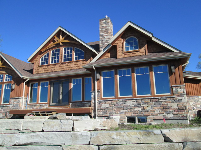 Lakefront Home with Cultured Stone Exterior - Rustic - Exterior ...