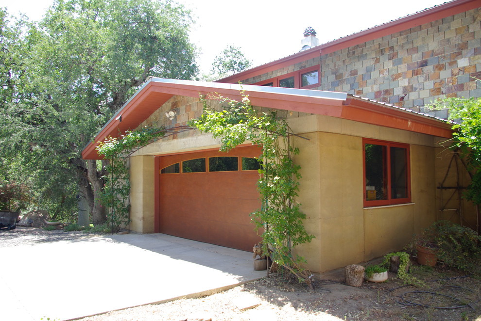 Rammed Earth Off-Grid Country Home: Garage - Rustic - Exterior - Other ...