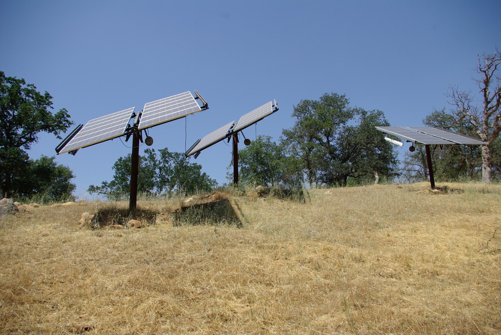 Rammed Earth Off-Grid Country Home: Tracking solar collectors - Rustic ...