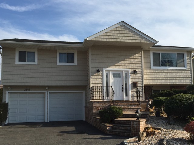 Siding Bellmore Monterey Sand Shakes With Door Traditional Exterior New York By Alpha