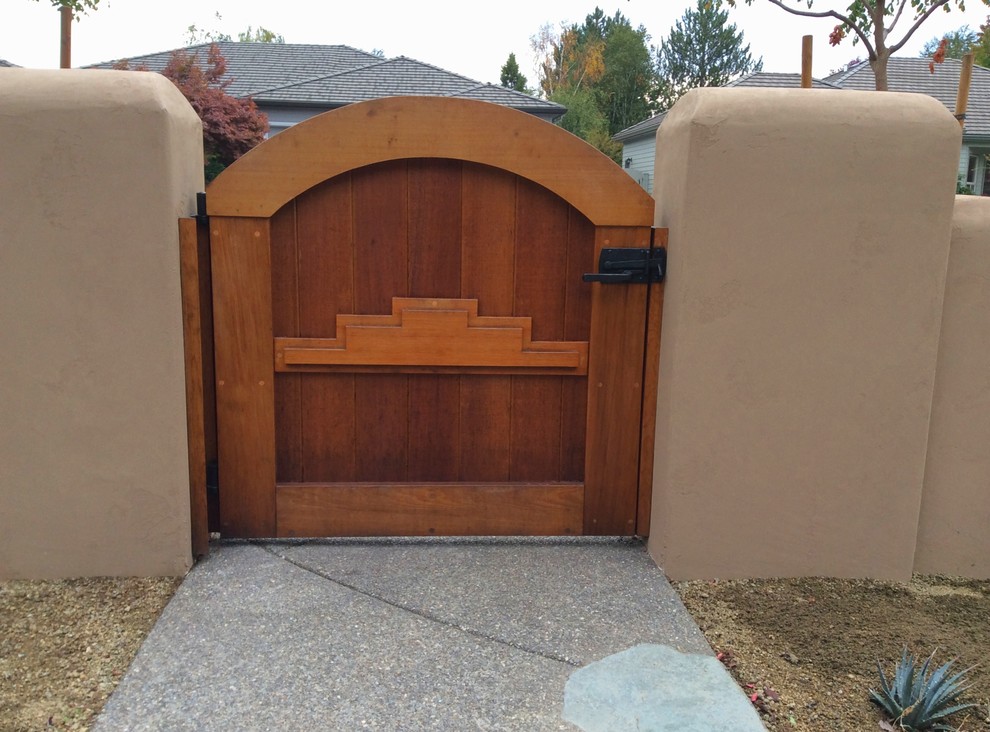 Spanish Style Home Design with Wooden Gate Yard Side - Southwestern ...