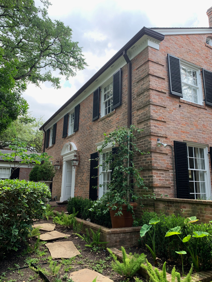 Traditional Brick Classic Home with White Trim and Black Shutters ...