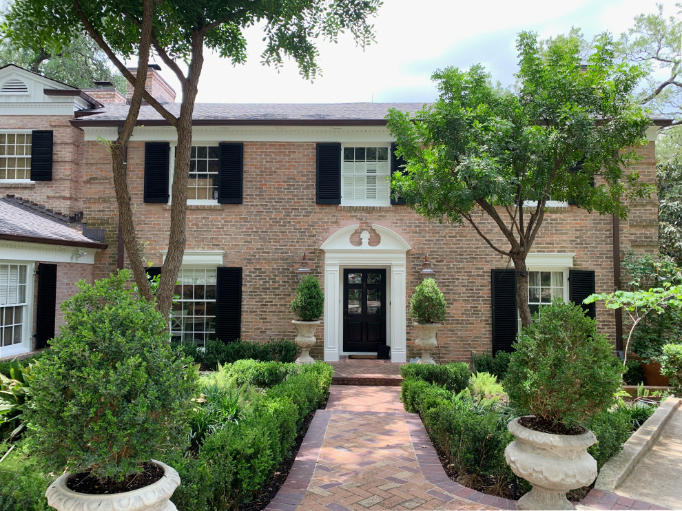 Traditional Brick Classic Home with White Trim and Black Shutters ...
